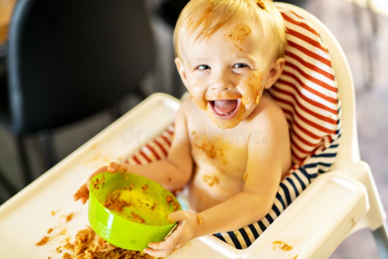 Little Baby Eating Spaghetti Dinner and Making a Mess Stock Photo ...