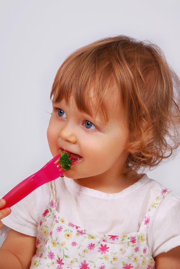 Little Baby Girl Eating Broccoli with Fork Stock Image - Image of ...