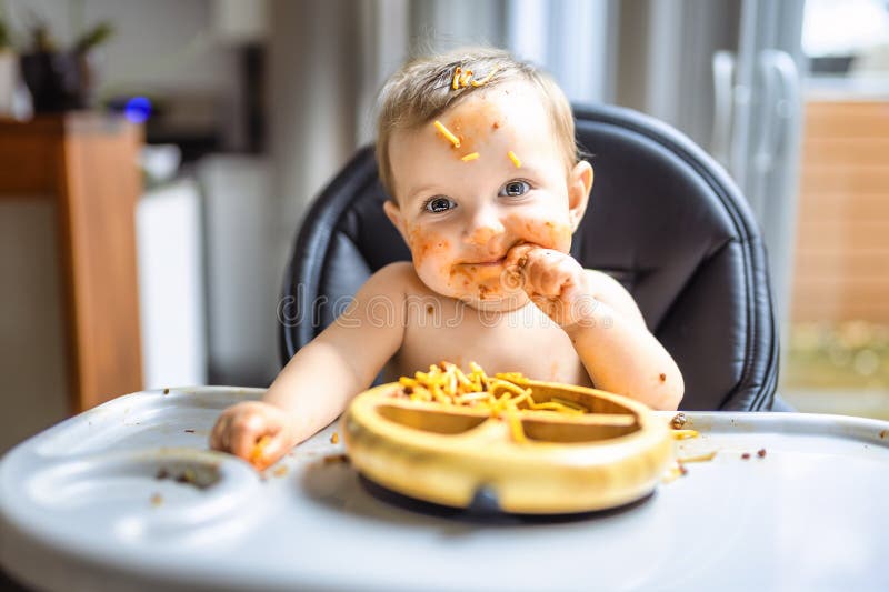 Little Baby Girl Eating Her Dinner and Making a Mess Stock Photo ...