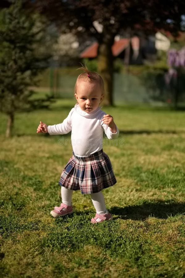 Baby Girl Playing in Backyard Stock Photo - Image of little, focus ...