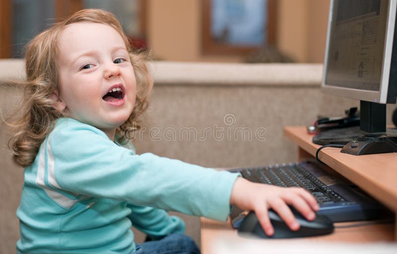 Little Baby Girl Using a Desktop Computer, Smiling Stock Image - Image ...