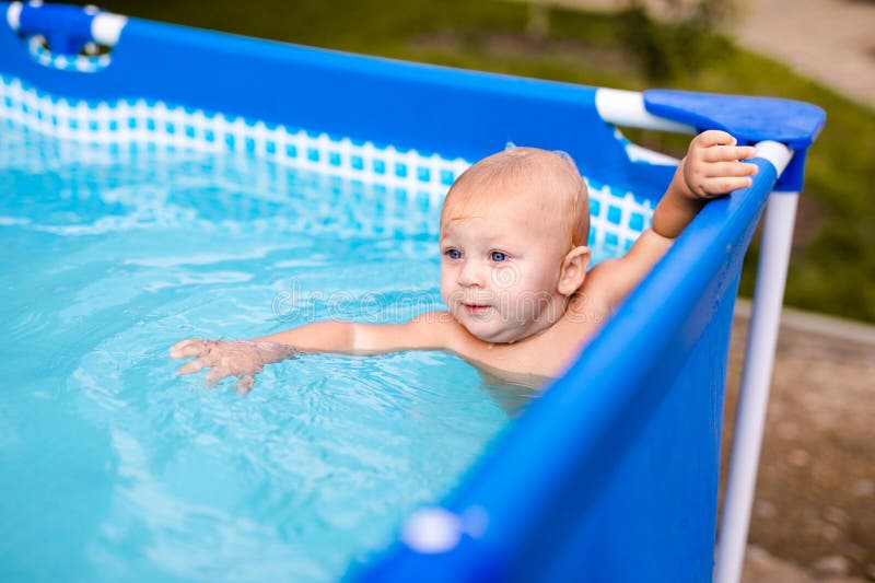 Little Baby Have a Fun with a Splash in Swimming Pool Stock Photo ...