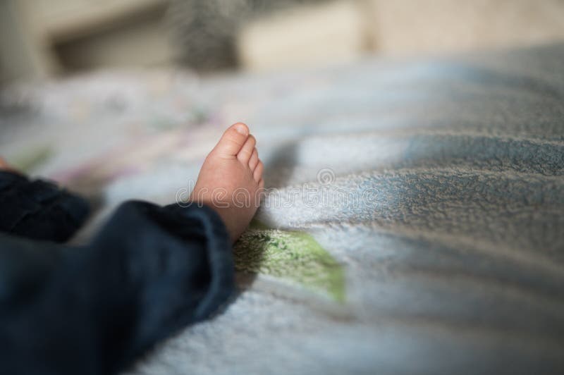 Little Baby Leg. Cute Little Baby Crawling on White Bed Sheet, Closeup ...