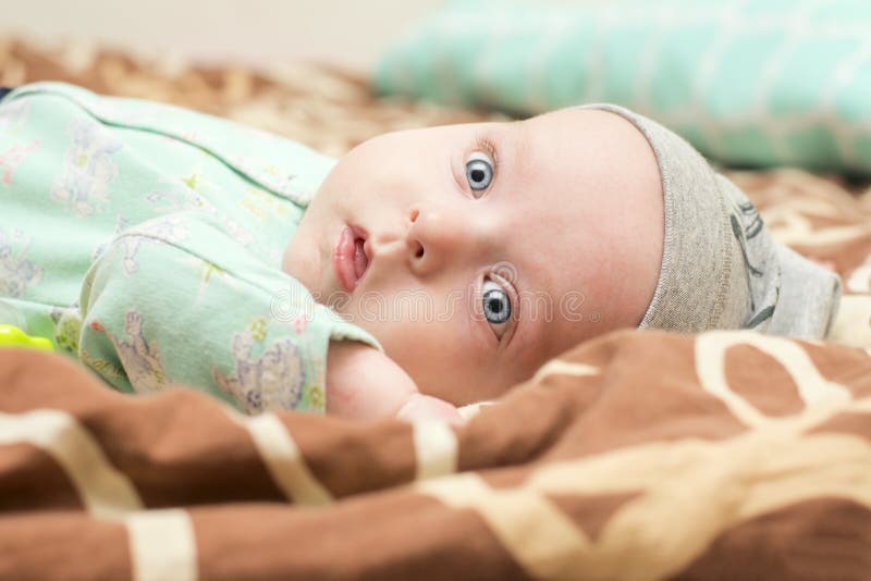 Pensive Kid Lying on the Bed Stock Image - Image of blue, cute: 115436239