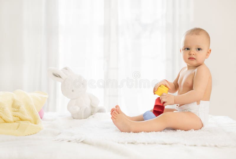 Little Baby in Nappy Playing with Toys Stock Image - Image of clean ...