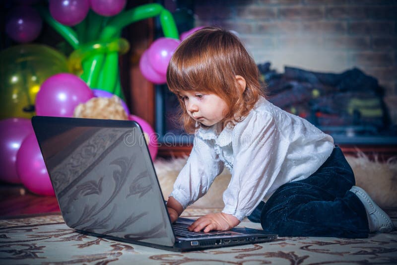 Baby Girl and Laptop stock photo. Image of toddler, pajamas - 22091420