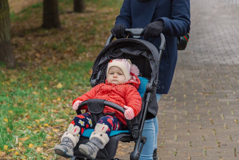 The Little Baby is Sitting in the Pram. Stock Image - Image of outdoor ...