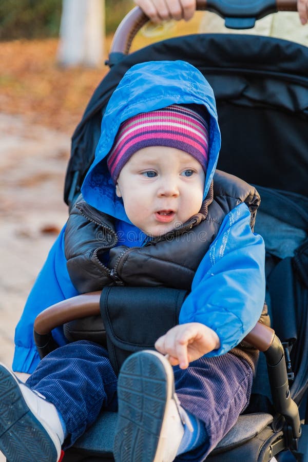 The Little Baby is Sitting in the Pram. Stock Photo - Image of girl ...