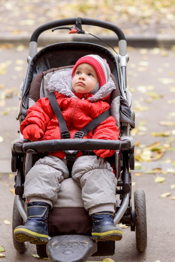 Little Baby is Sitting in a Stroller Stock Photo - Image of cute ...