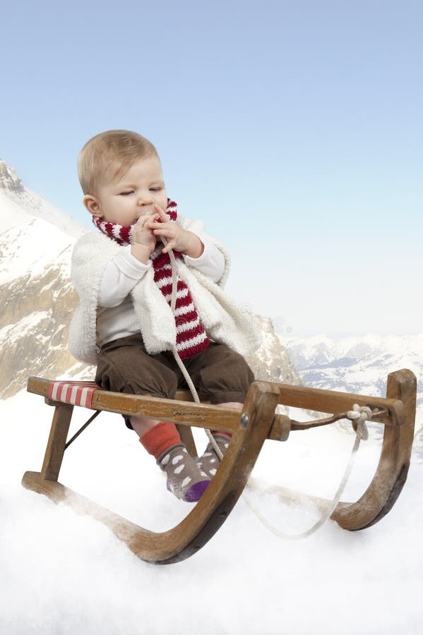 Little baby on a sledge stock image. Image of scarf, beige - 28832265