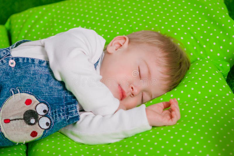 Little Baby Sleeping on Green Cushion Stock Photo - Image of dreams ...