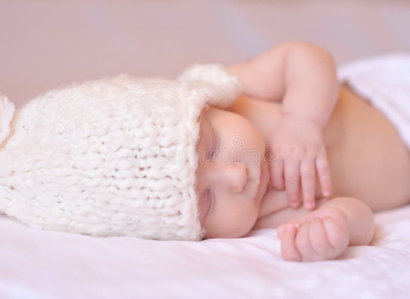 Little Baby Sleeping with White Knitted Hat on Stock Photo - Image of ...