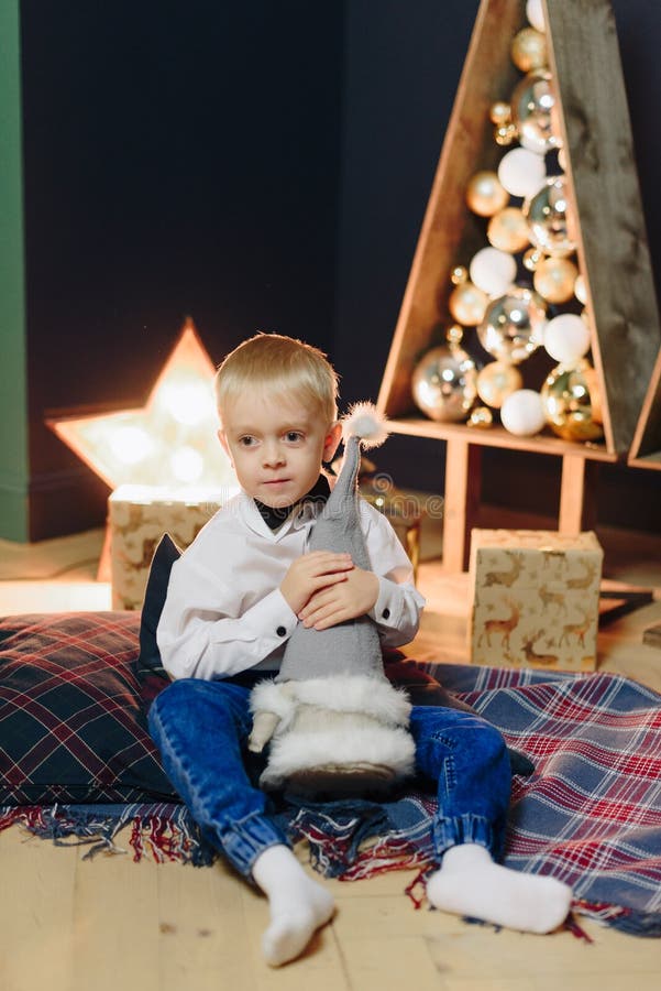 Little Beautiful Boy on the Background of a Decorated Christmas Tree ...