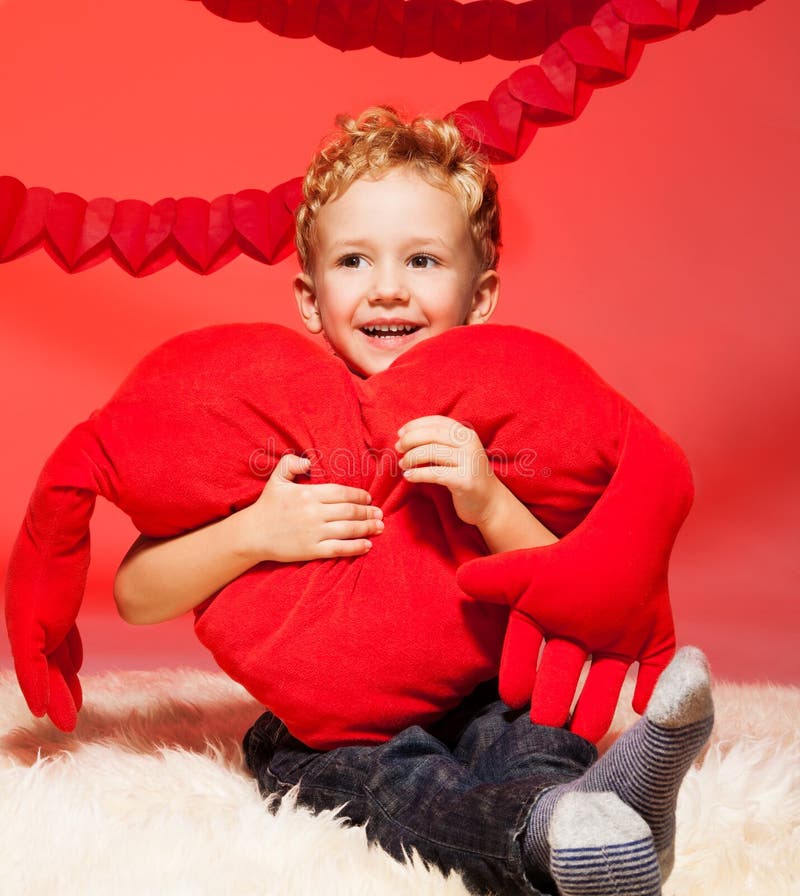 Little Blond Boy with Heart Pillow Stock Photo - Image of hugging ...