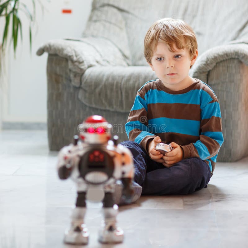 Little Blond Boy Playing with Robot Toy at Home, Indoor. Stock Image ...