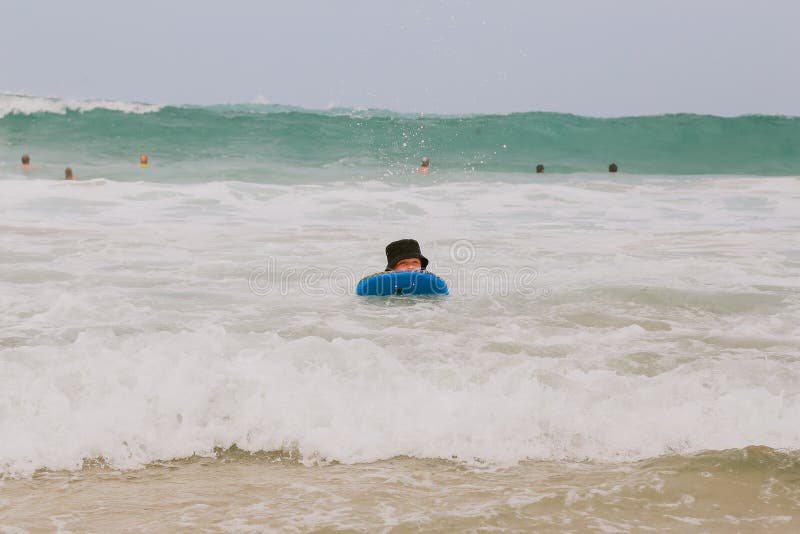 Little Blonde Boy Swimming at the Beach with Boogie Board Stock Photo ...