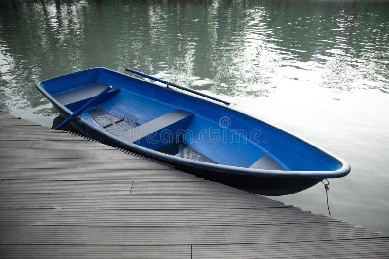 Little Blue Boat on the Pier . Close Up Blue Boat on the Lake Stock ...
