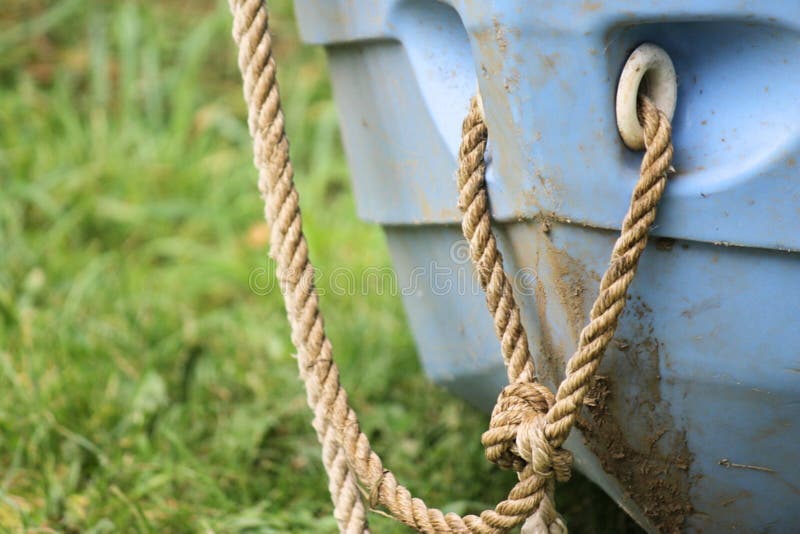 Little blue boat with rope stock photo. Image of water - 76857848