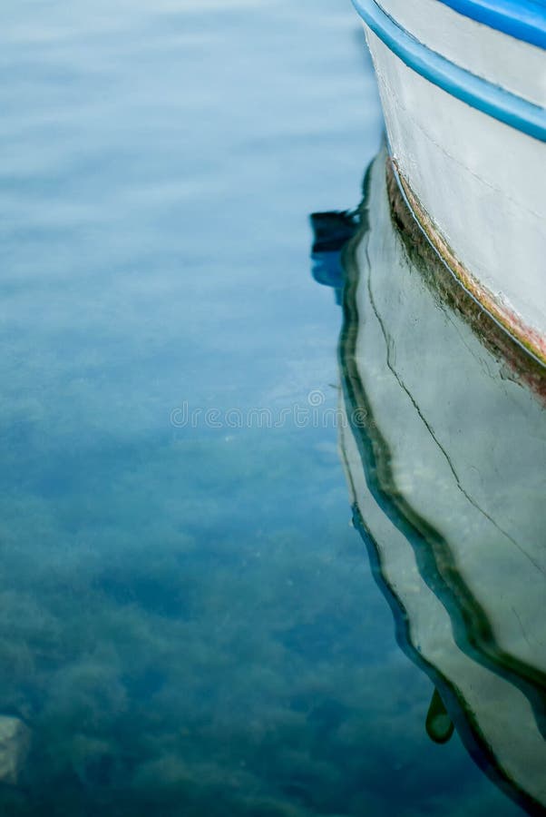 A Little Blue Row Boat in Shallow Water Stock Photo - Image of lagoon ...