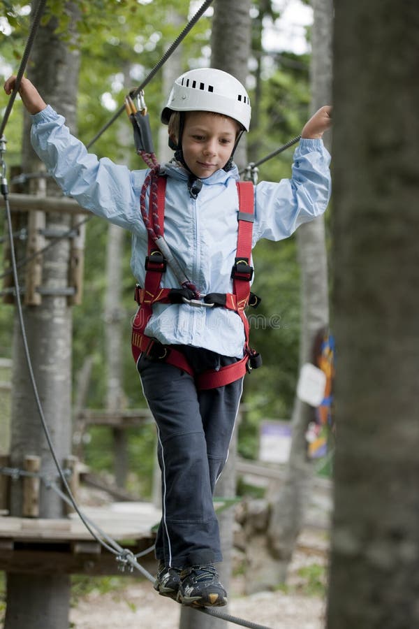 Little Boy in Adventure Park Stock Photo - Image of concentration ...