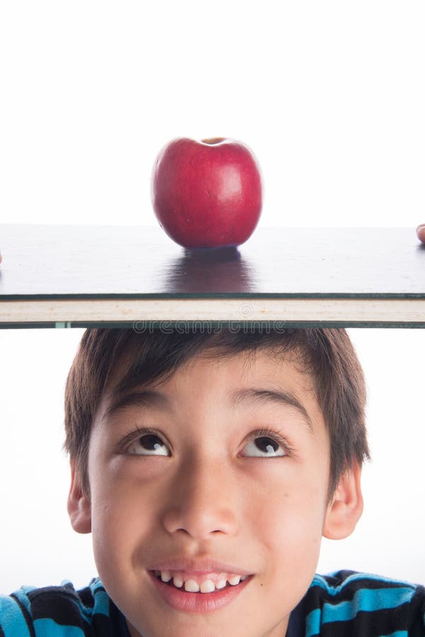 Little Boy with Apple on the Book on His Head Education Concept Back To ...