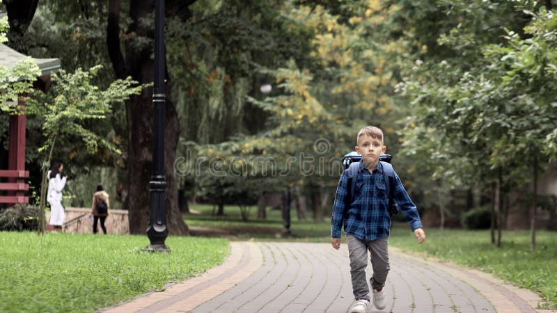 Little Boy with Backpack Going To School. First Grader Stock Footage ...