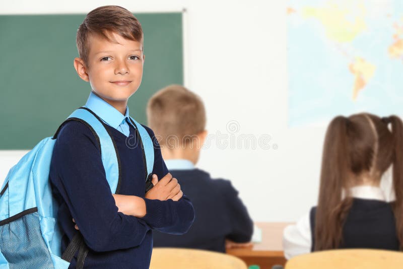Little Boy with Backpack in School Classroom Stock Photo - Image of ...