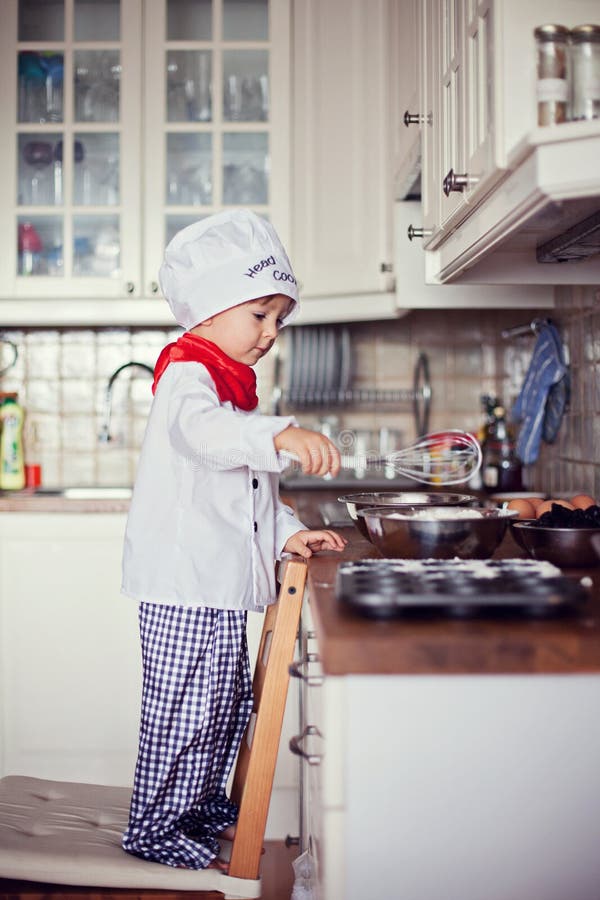 Little boy, baking muffins stock photo. Image of cook - 37060486