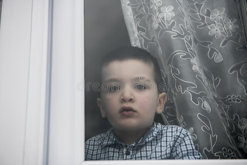 Sad Little Boy Behind a Window Look Sad Stock Image - Image of ...