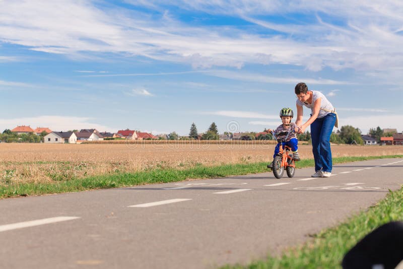 Little boy on a bicycle. stock image. Image of learn - 60145817
