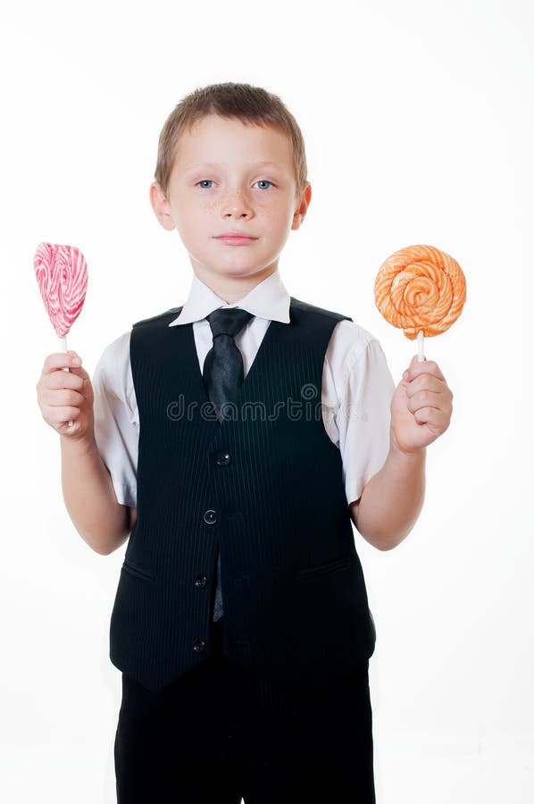 Boy showing lollipop candy stock image. Image of body - 11238199