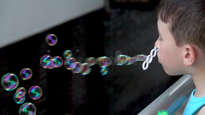 Little Boy Blowing and Making Soap Bubbles. Stock Video - Video of ...