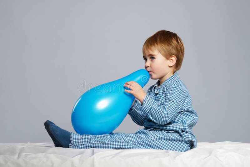 Little boy in blue pyjamas stock photo. Image of playing - 38917730