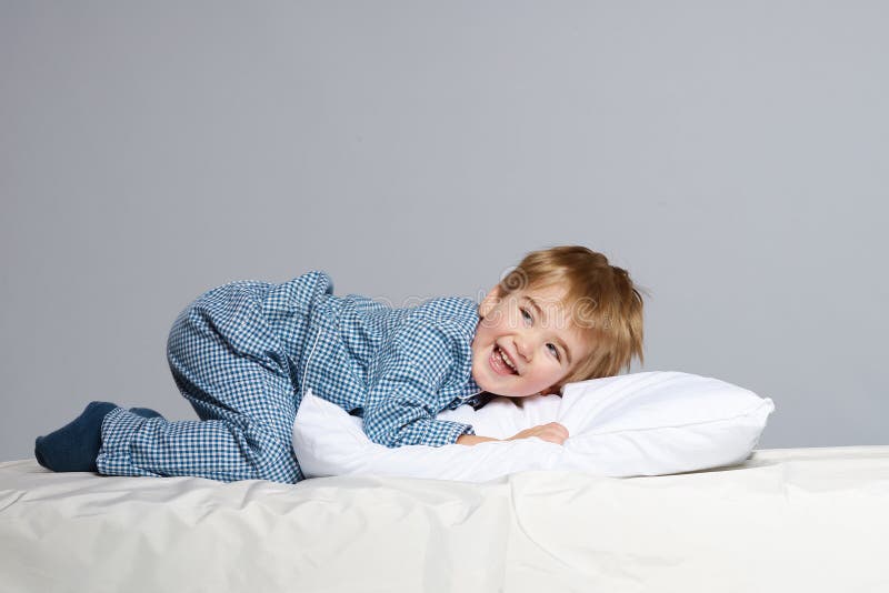 Little boy in blue pyjamas stock image. Image of child - 38917577