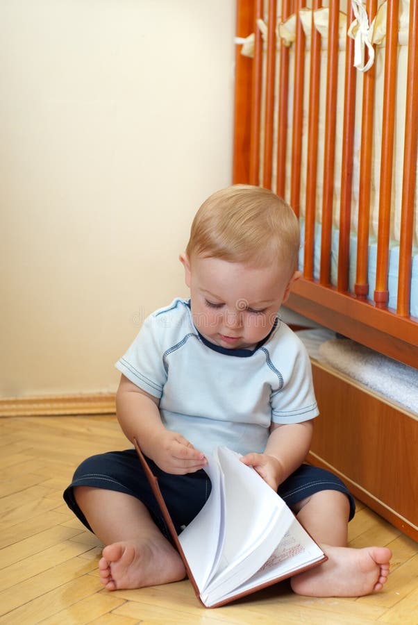 Little boy with book stock photo. Image of serious, infant - 10796742