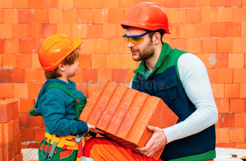 Little Boy Bricklayer. Brothers are Building Together Stock Photo ...