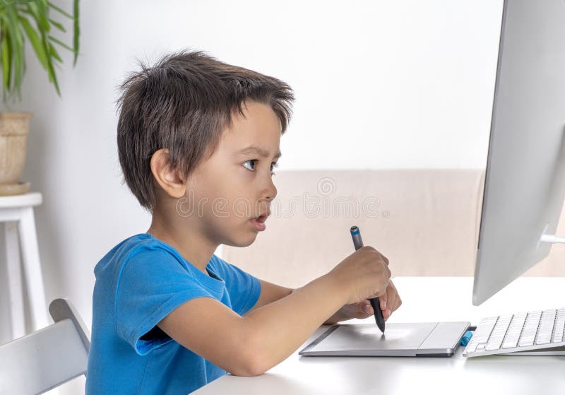 Little Boy Browses the Internrt on a Desktop Computer with Graphics ...