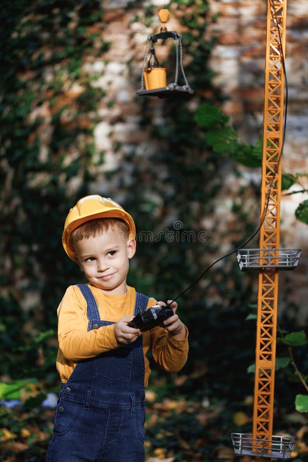 Little Boy Builder in Uniform Working on Construction Site. Child ...