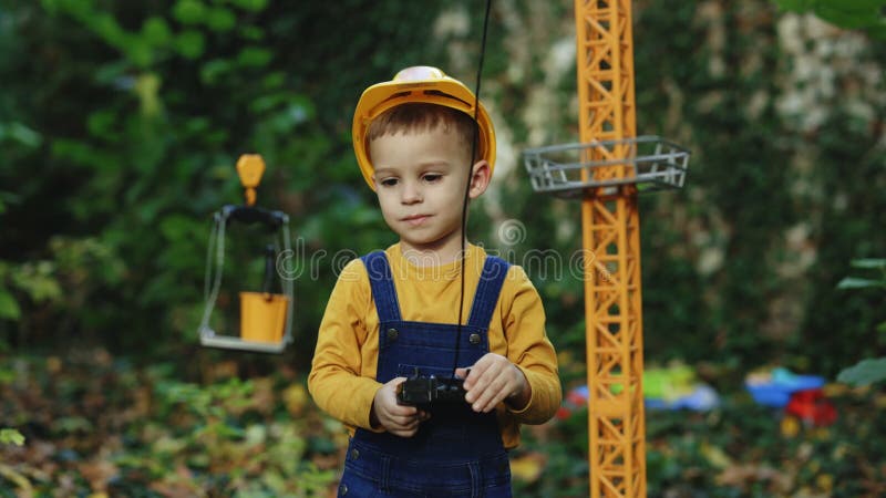 Little Boy Builder in Uniform Working on Construction Site. Child ...
