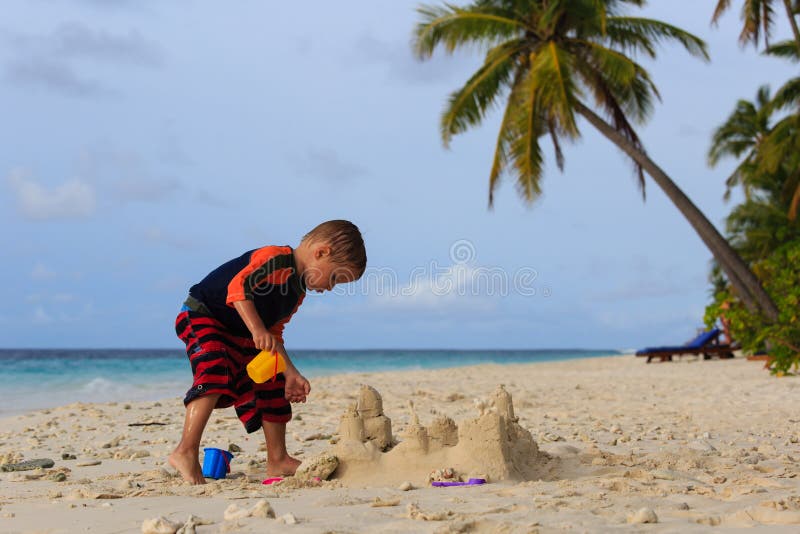 Little Boy Building Sand Castle on Tropical Beach Stock Photo - Image ...