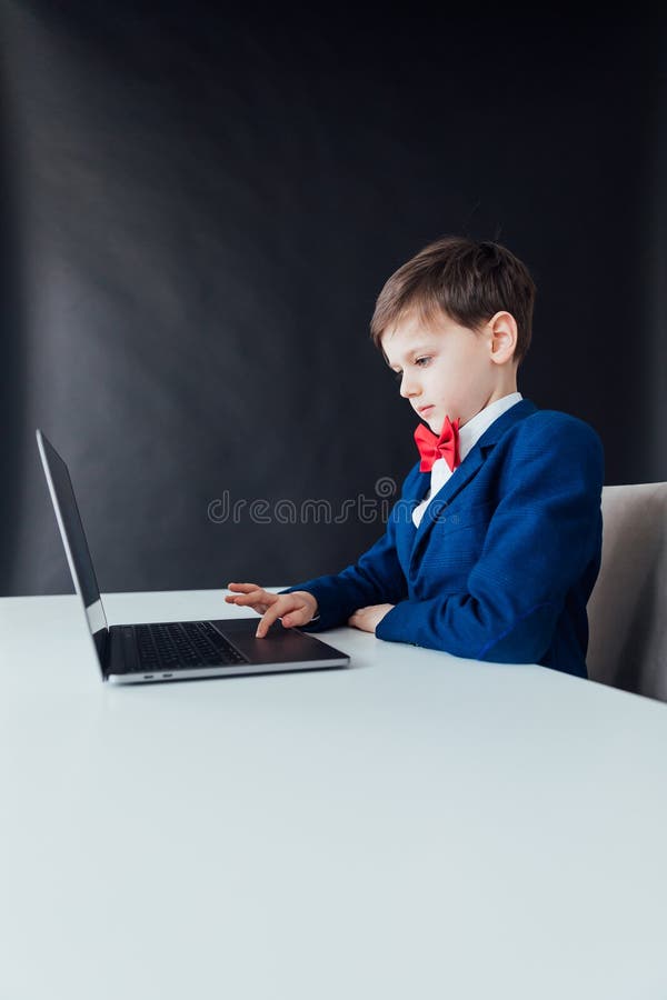 Little Boy in Business Suit Studying at Laptop Stock Photo - Image of ...