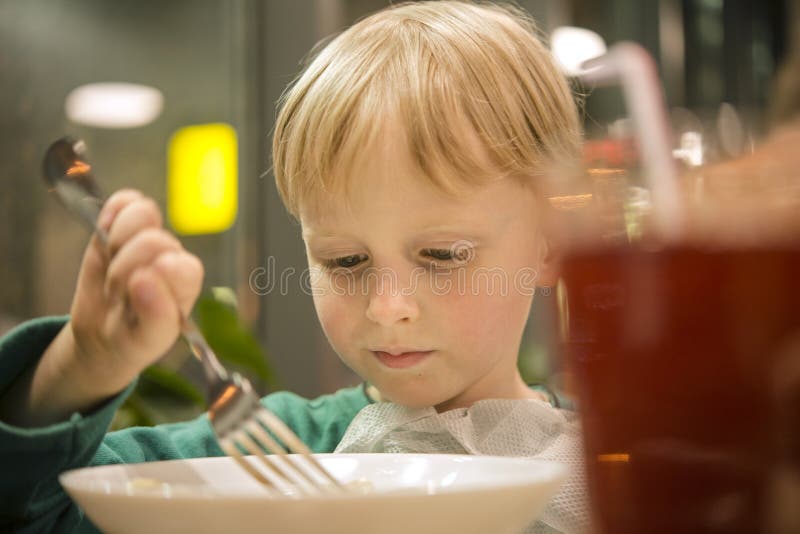Little Boy in a Cafe Eating Dumplings Stock Photo - Image of eats ...