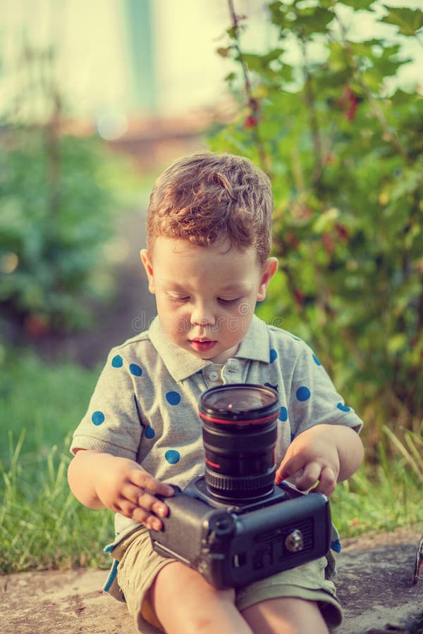 Boy with camera stock photo. Image of professional, photographer ...