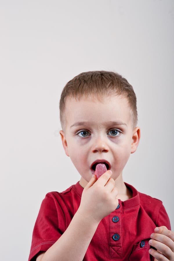 Little boy with candy stock photo. Image of studio, candy - 64892052