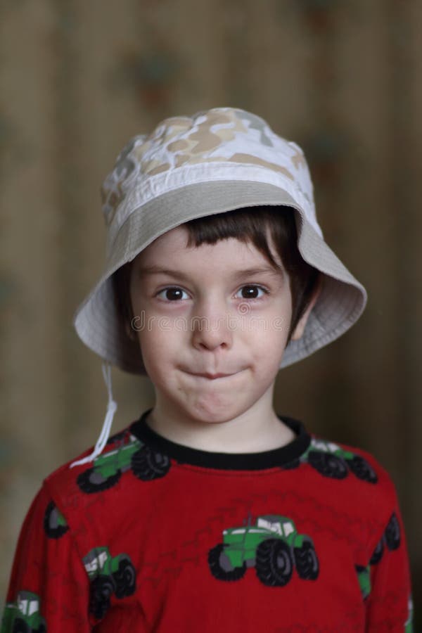 A little boy in a cap stock image. Image of play, face - 66715821
