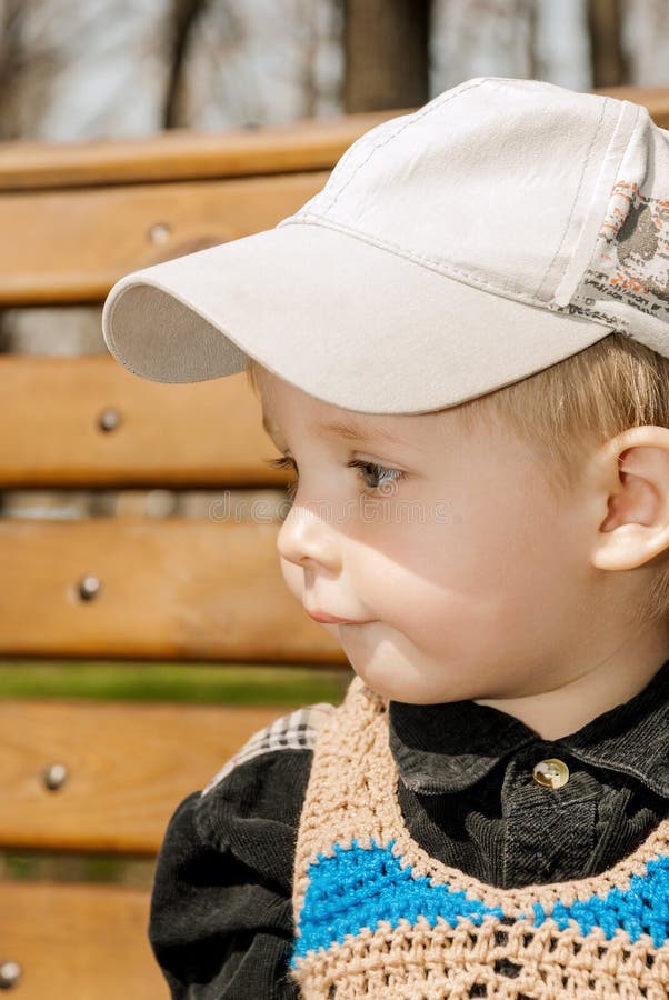 Little Boy in a Cap Outdoors Stock Image - Image of outdoors, handsome ...