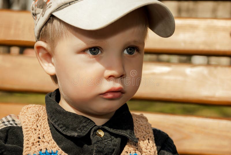 Little Boy in a Cap Outdoors Stock Photo - Image of beautiful, child ...