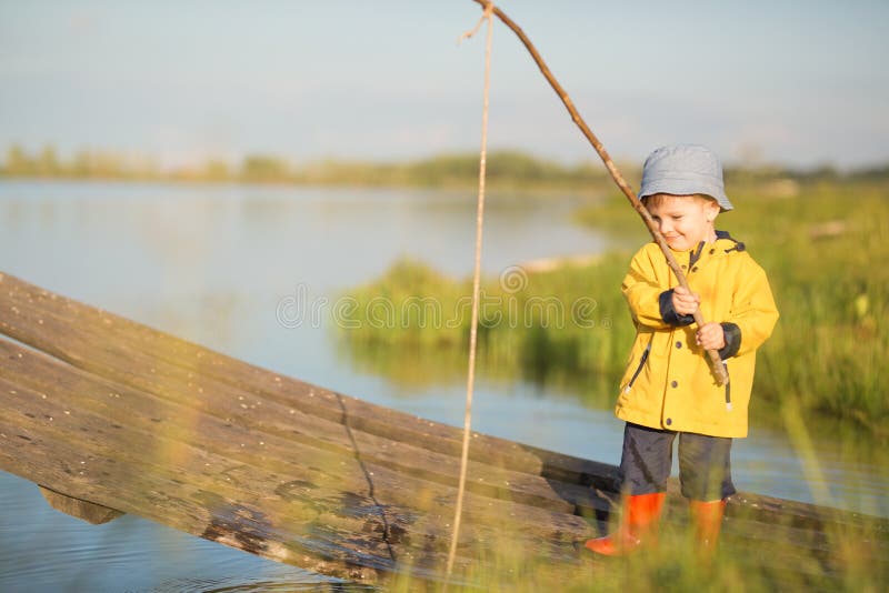 Little Boy Catching a Fish from Wooden Dock Stock Image - Image of ...