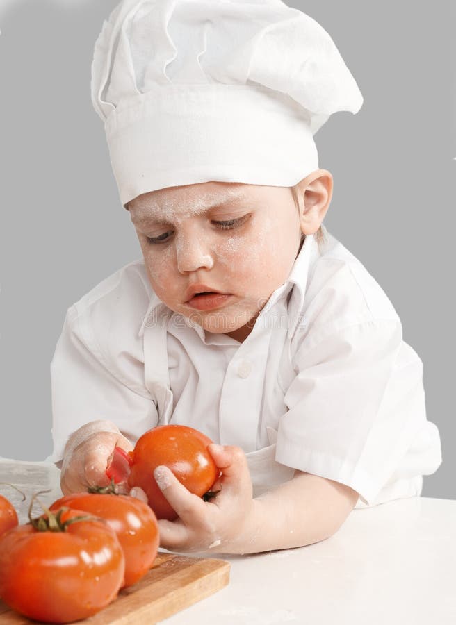Little Boy Chef Cooking Tomatoes Stock Image - Image of funny, bakery ...