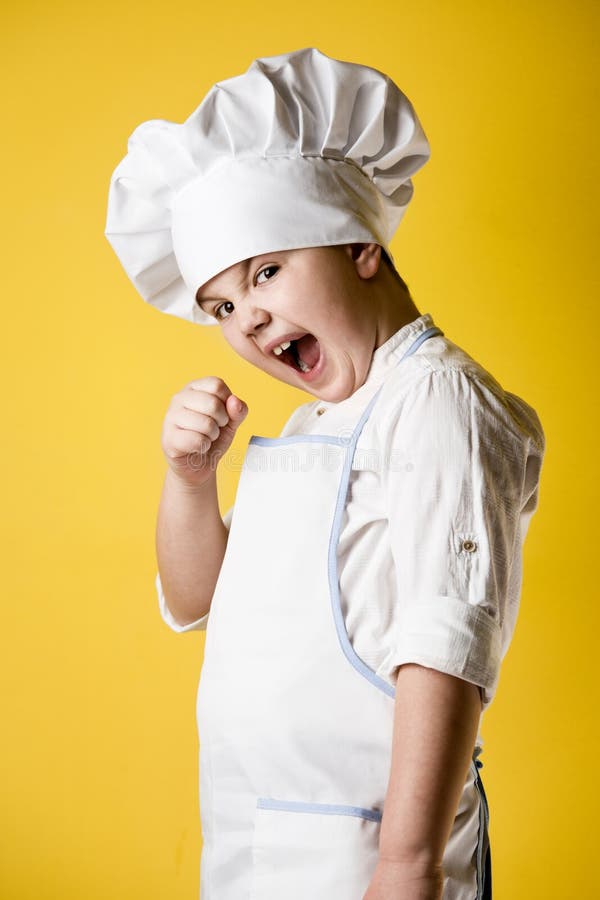 Little boy chef in uniform stock photo. Image of occupation - 37701016